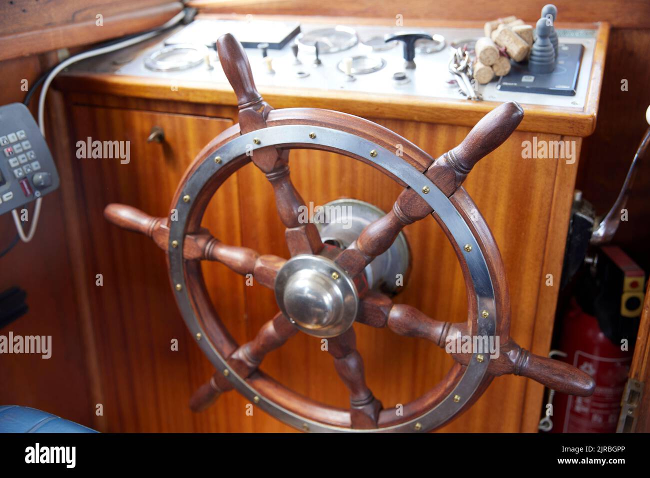 Wooden helm of motorboat on dashboard in cockpit Stock Photo - Alamy