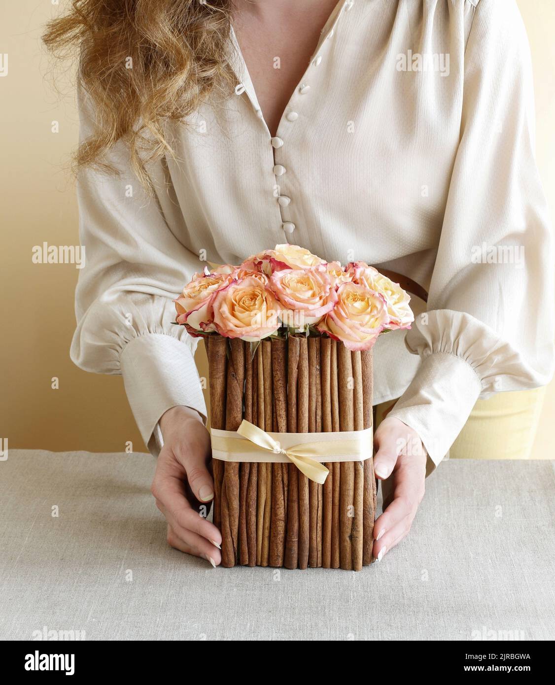 Florist at work: How to make floral arrangement with roses and cinnamon ...