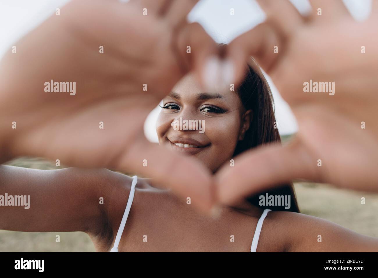 Hand heart face hi-res stock photography and images - Alamy