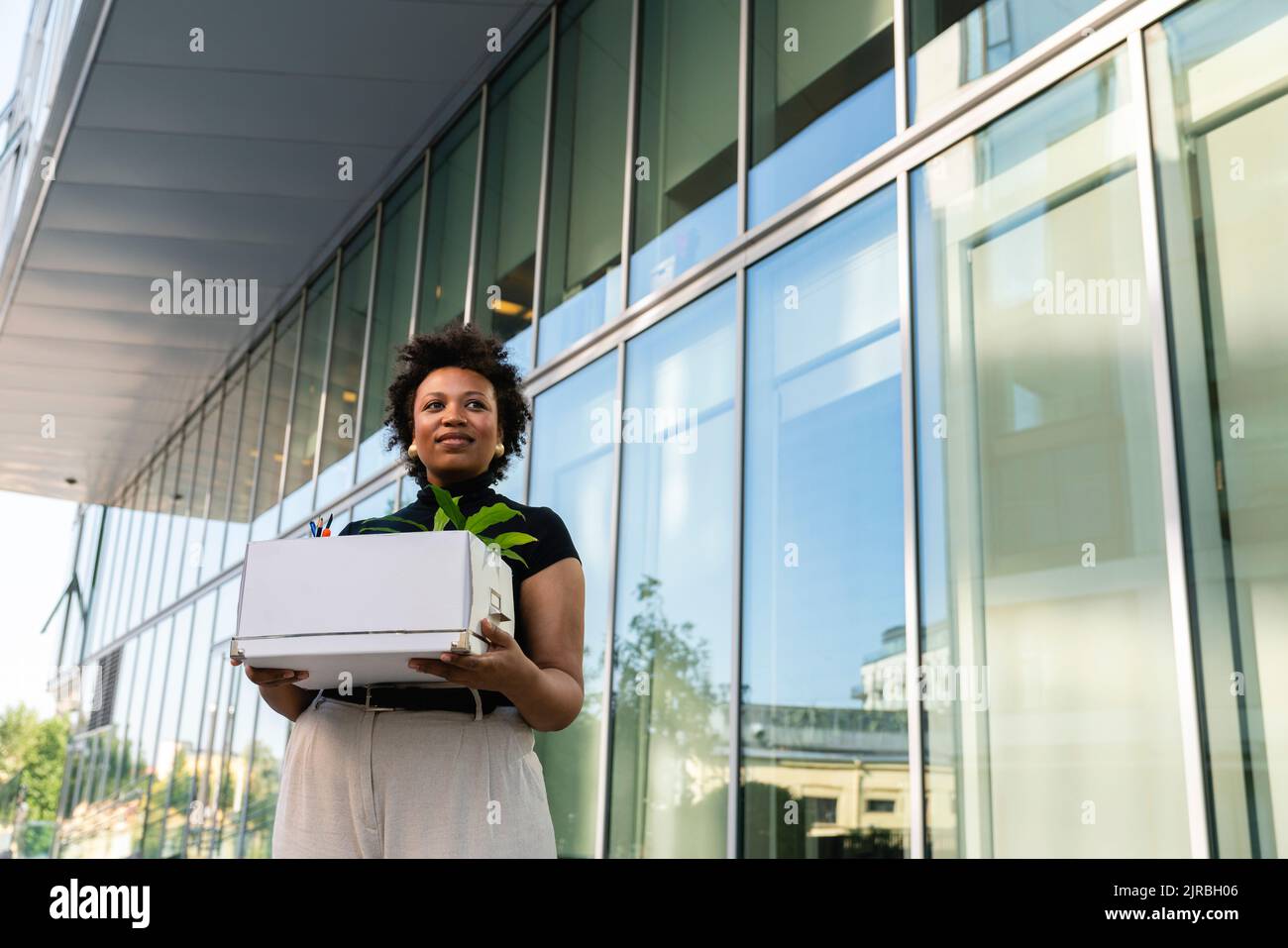 Office person holding box hi-res stock photography and images - Alamy