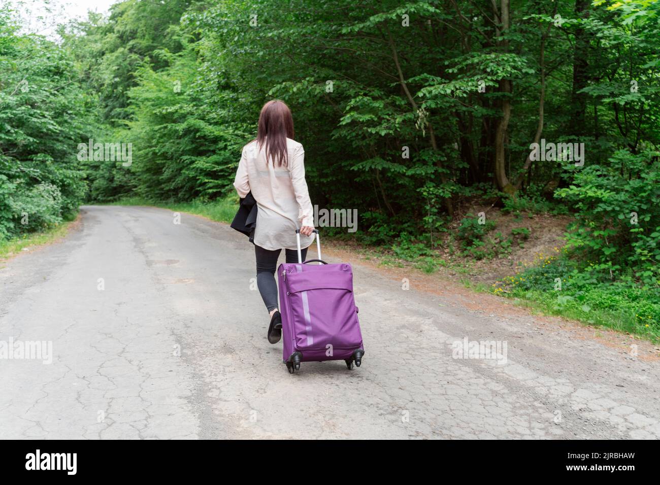 Woman leaving suitcase hi-res stock photography and images - Alamy