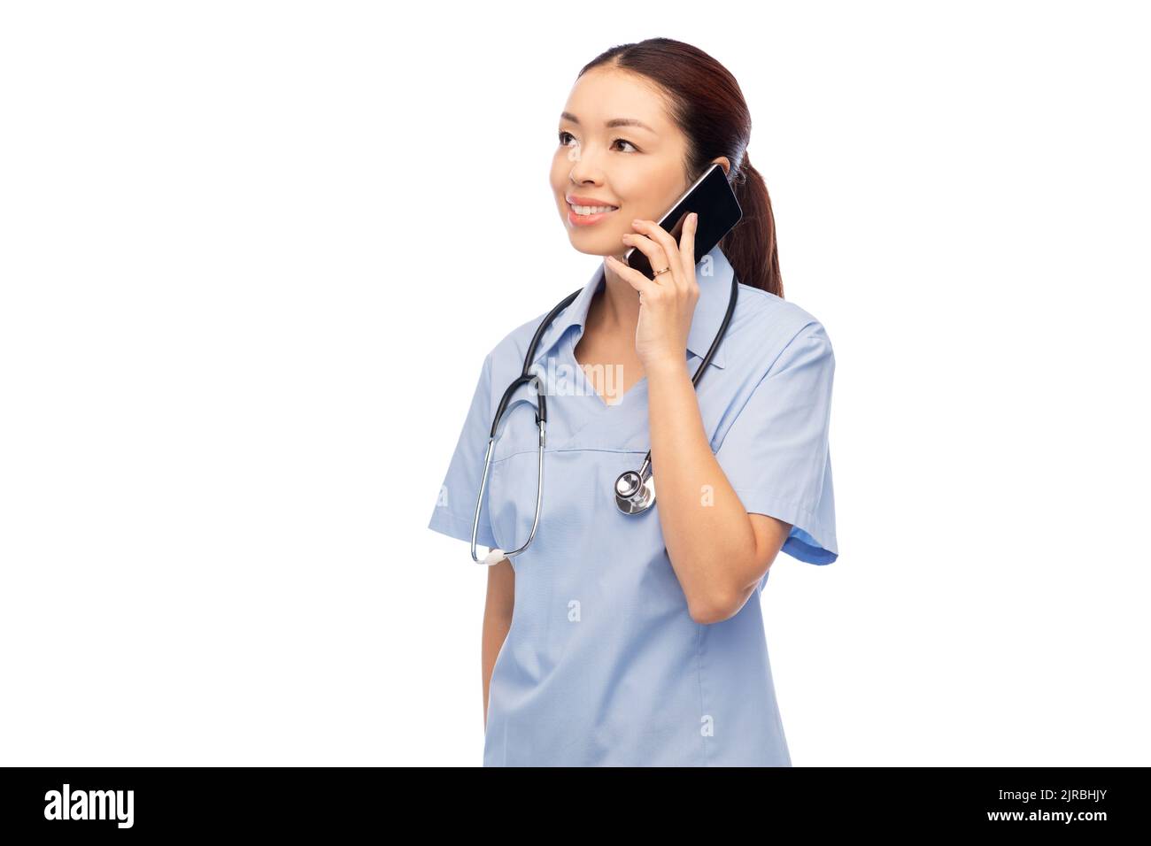 asian female doctor or nurse calling on smartphone Stock Photo - Alamy