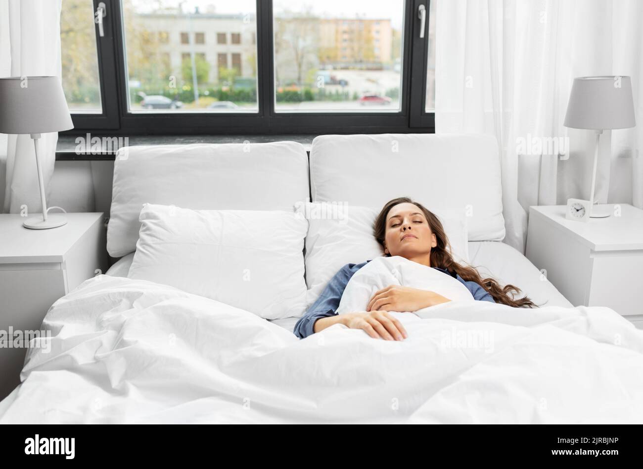 young woman sleeping in bed at home Stock Photo - Alamy
