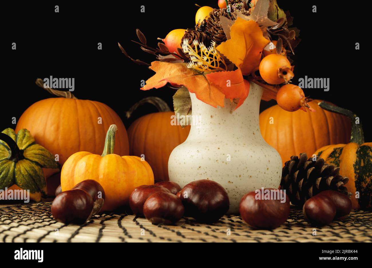 Handmade ceramic flower vase with decorative pumpkins, chestnuts and ...