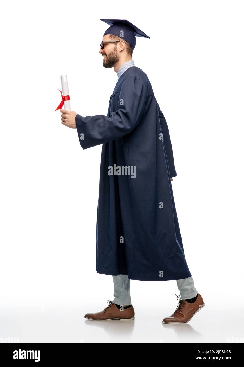 Graduate student walking diploma in hi-res stock photography and images ...