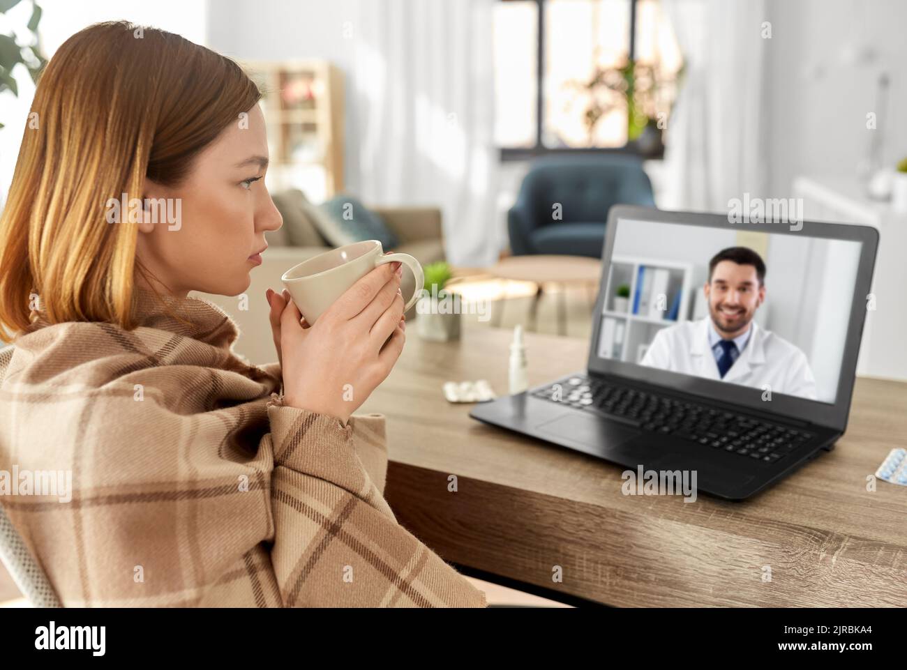 sick woman having video call with doctor at home Stock Photo - Alamy