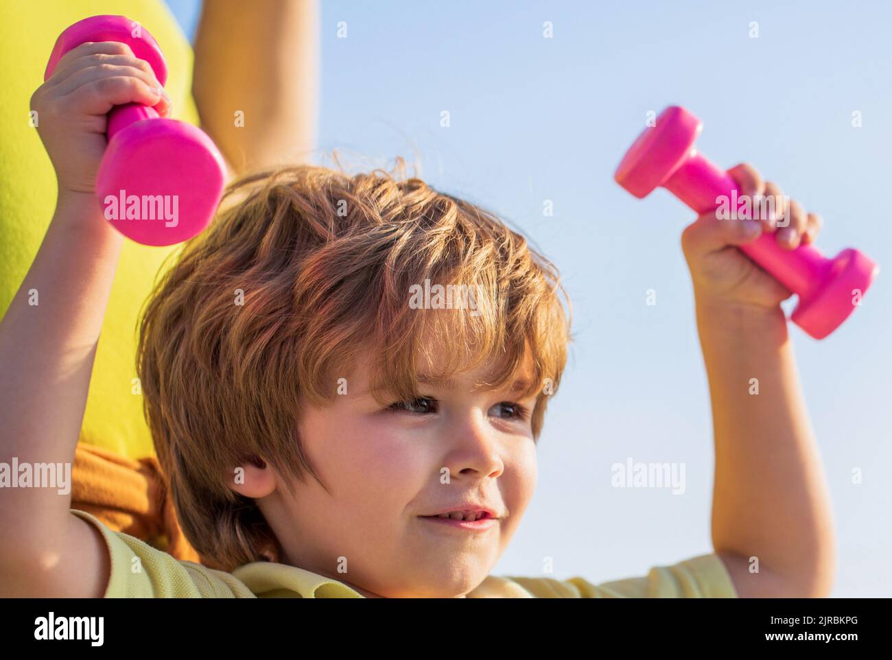 Fitness child. Kid exercising with dumbbells. Sport for little children ...