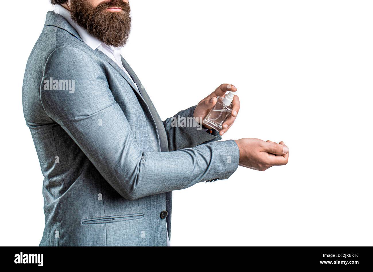 Masculine perfume, bearded man in a suit. Male holding up bottle of ...