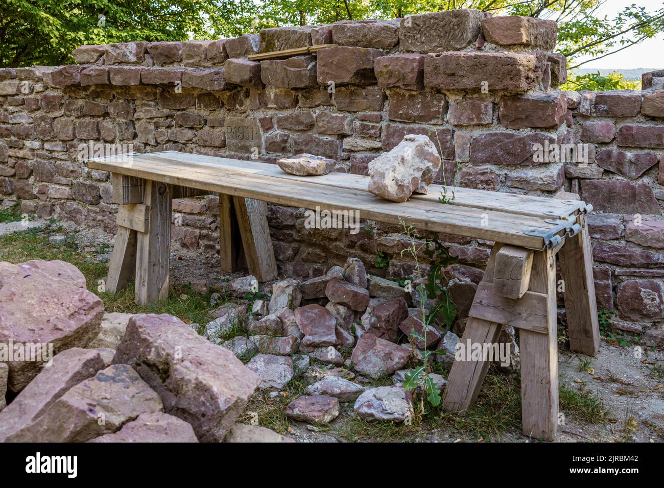 Restoration of an old sandstone wall with traditional materials and ...