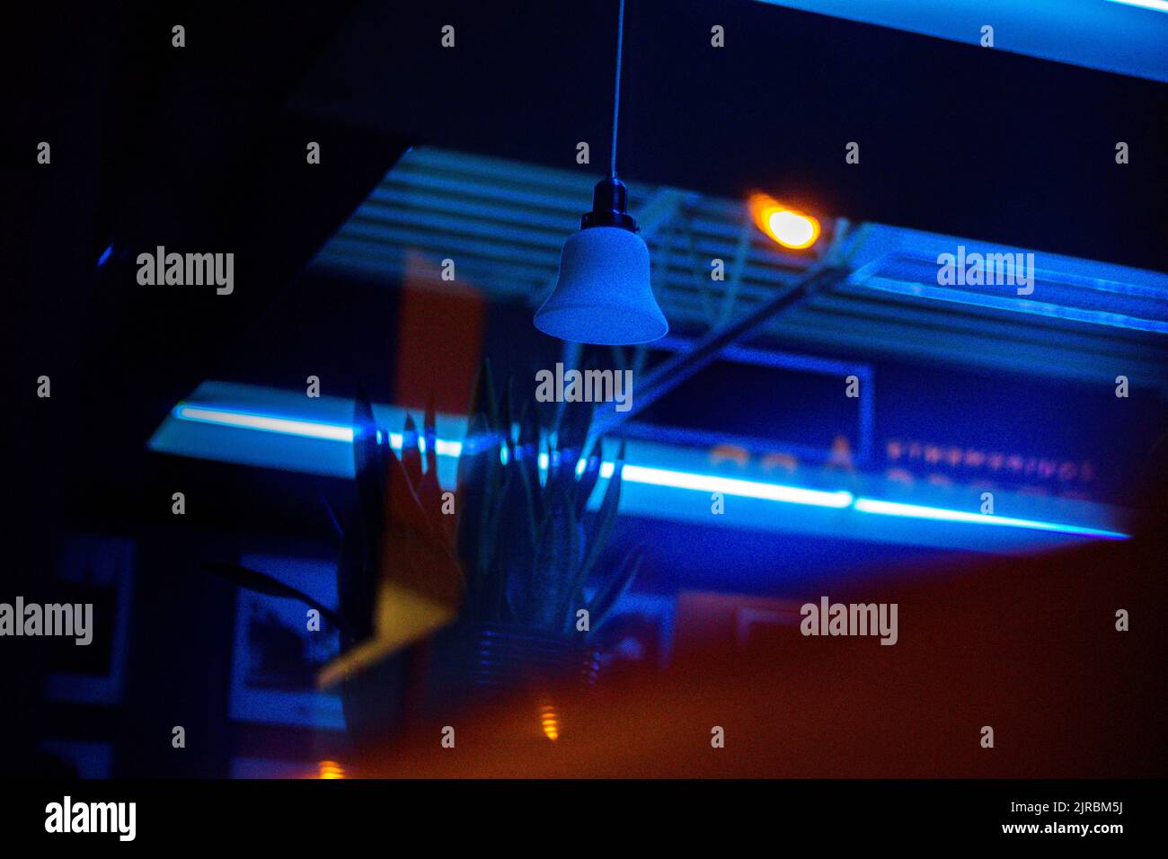 A peek throught a restaurant window at night Stock Photo - Alamy