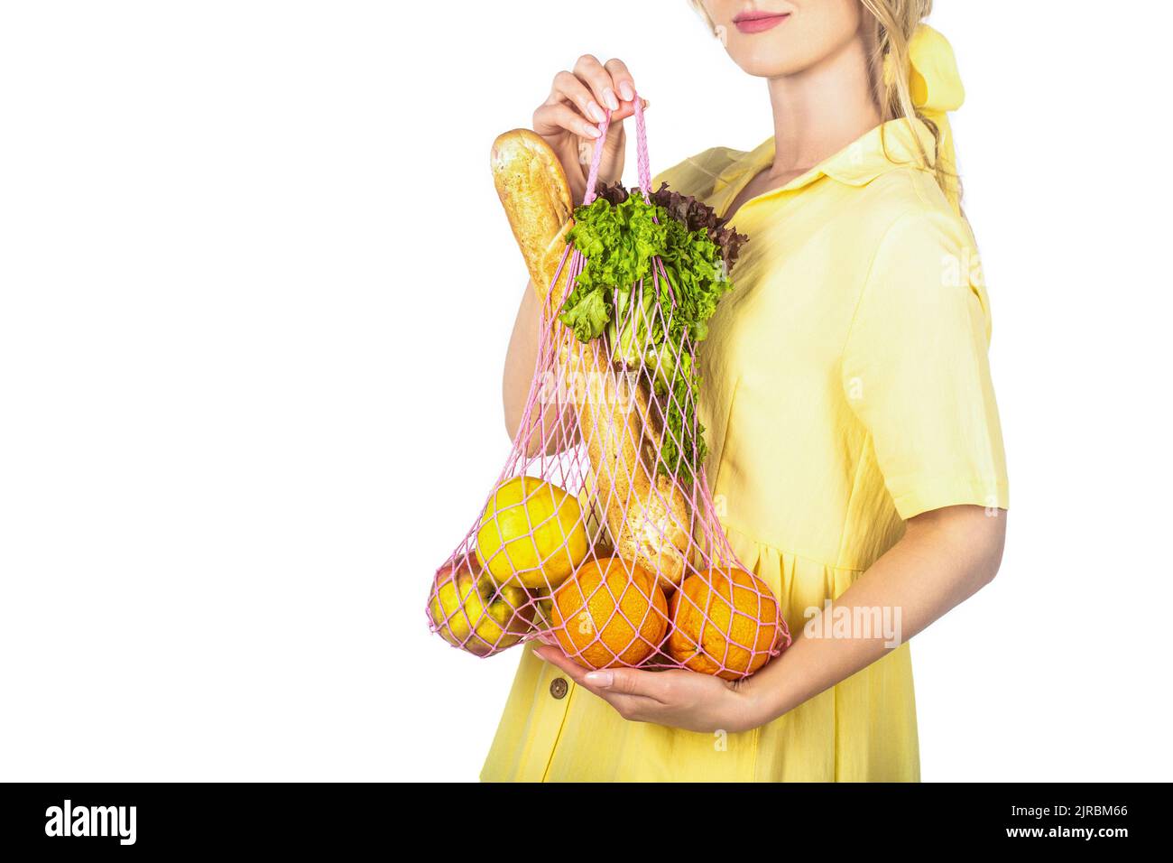 Woman holding eco-friendly string reusable net bag fruits, vegetables ...
