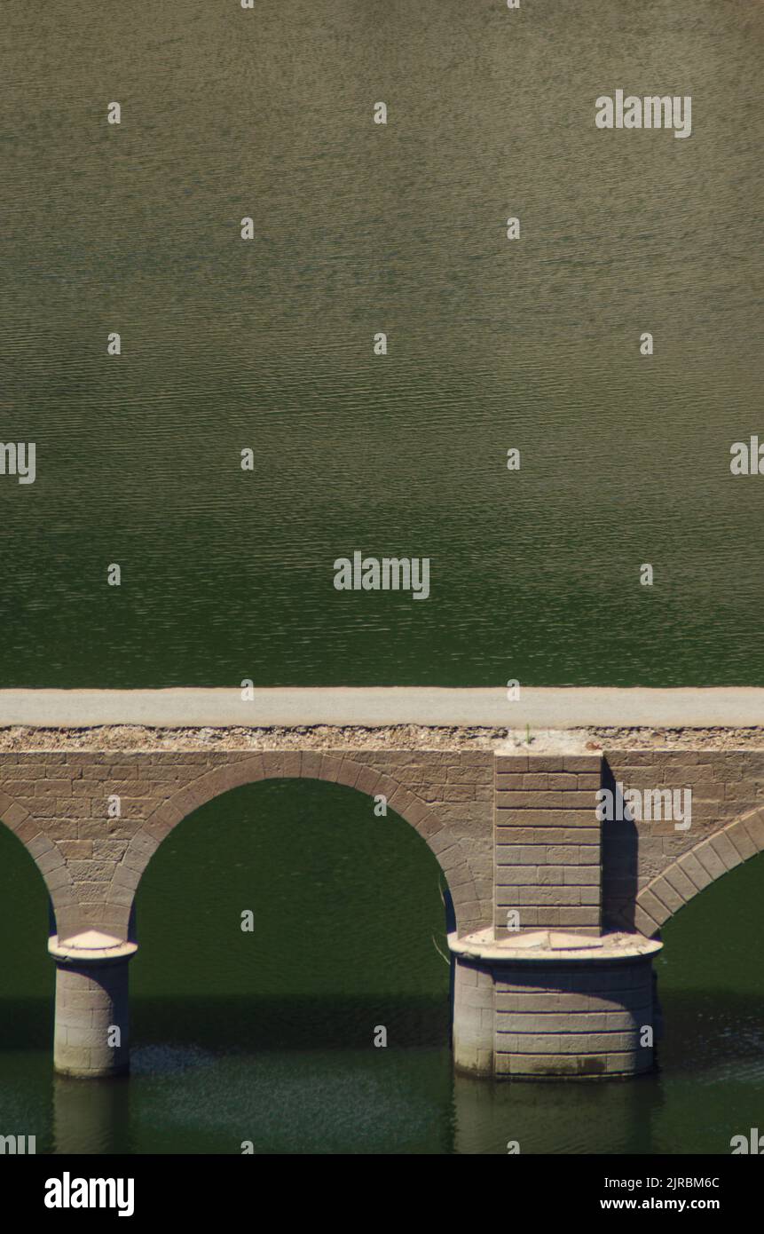 landscape of dry earth ground and viaduct, extreme drought in Lindoso ...