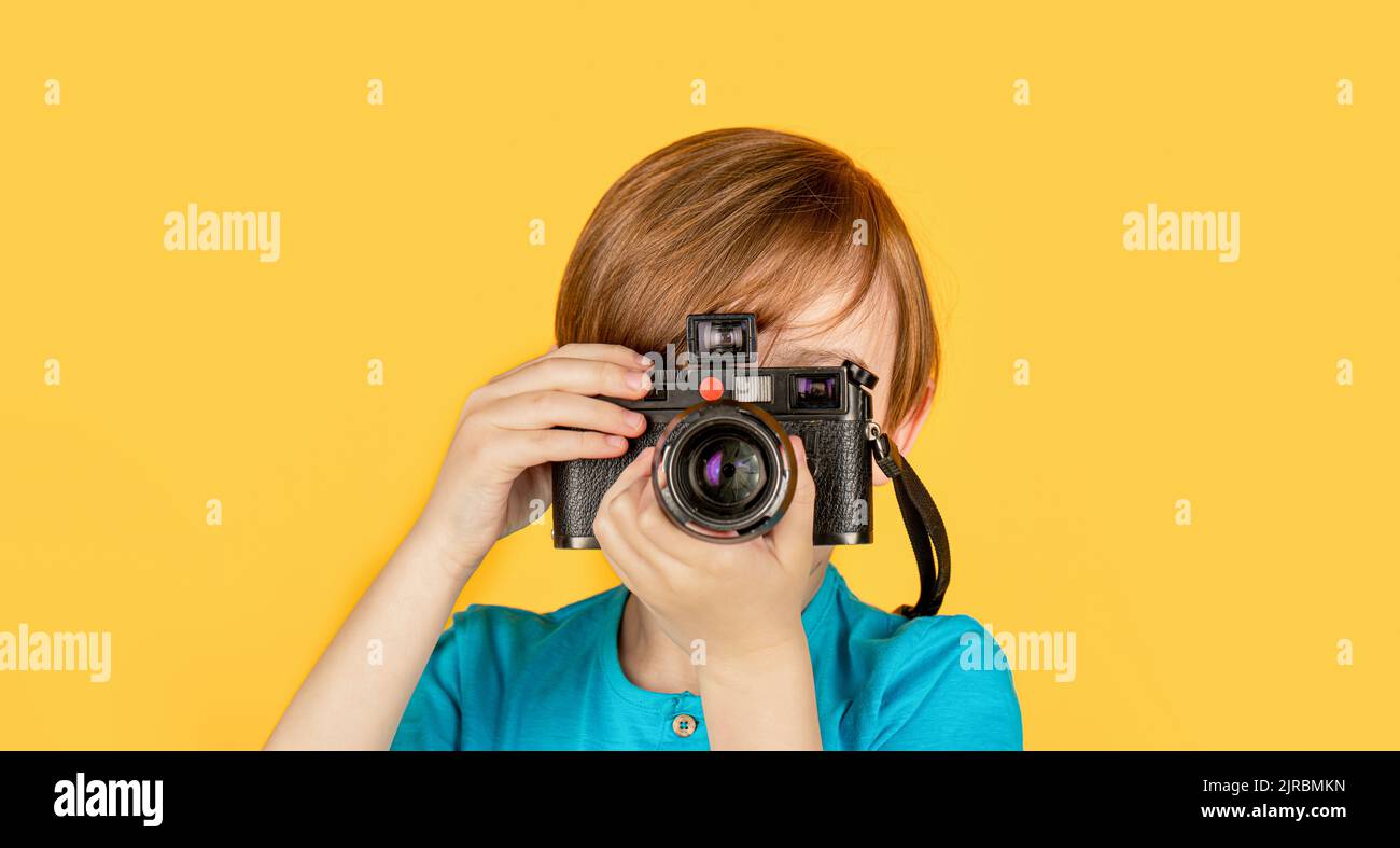Boy using a cameras. Baby boy with camera. Cheerful smiling child ...