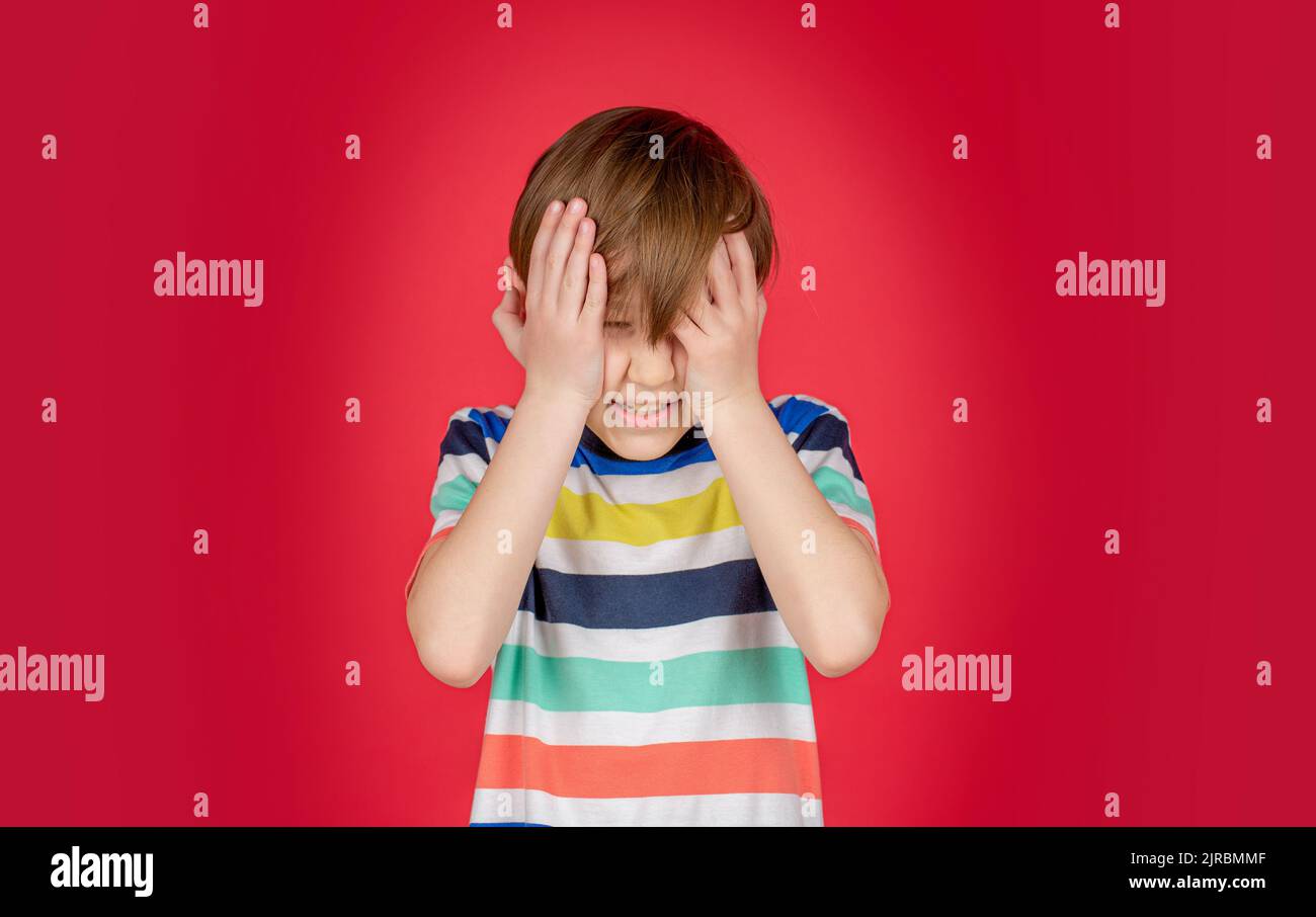 Suffering migraine. Headache because stress. Portrait of a sad boy ...