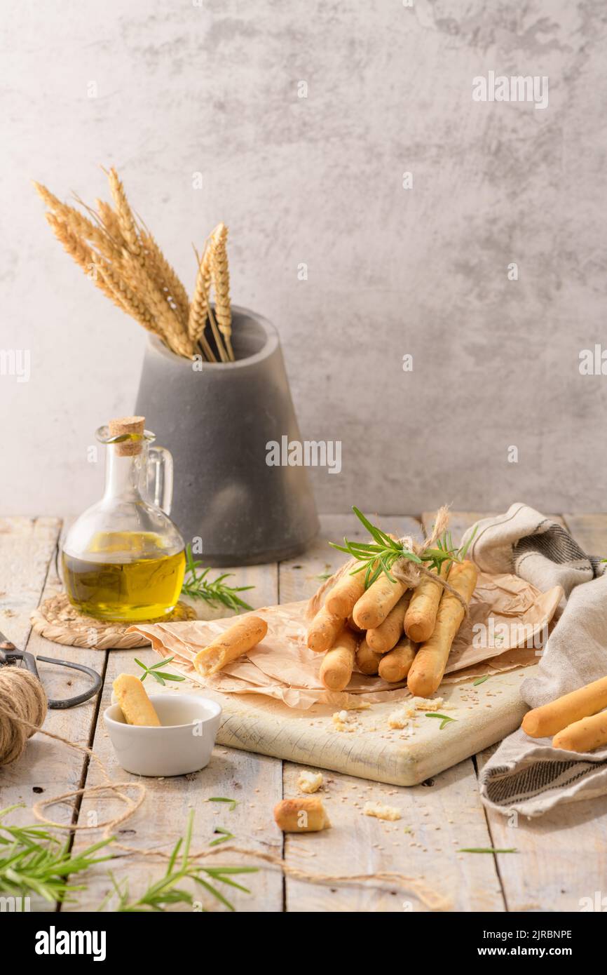 Traditional italian breadsticks grissini with rosemary, olive oil and ...
