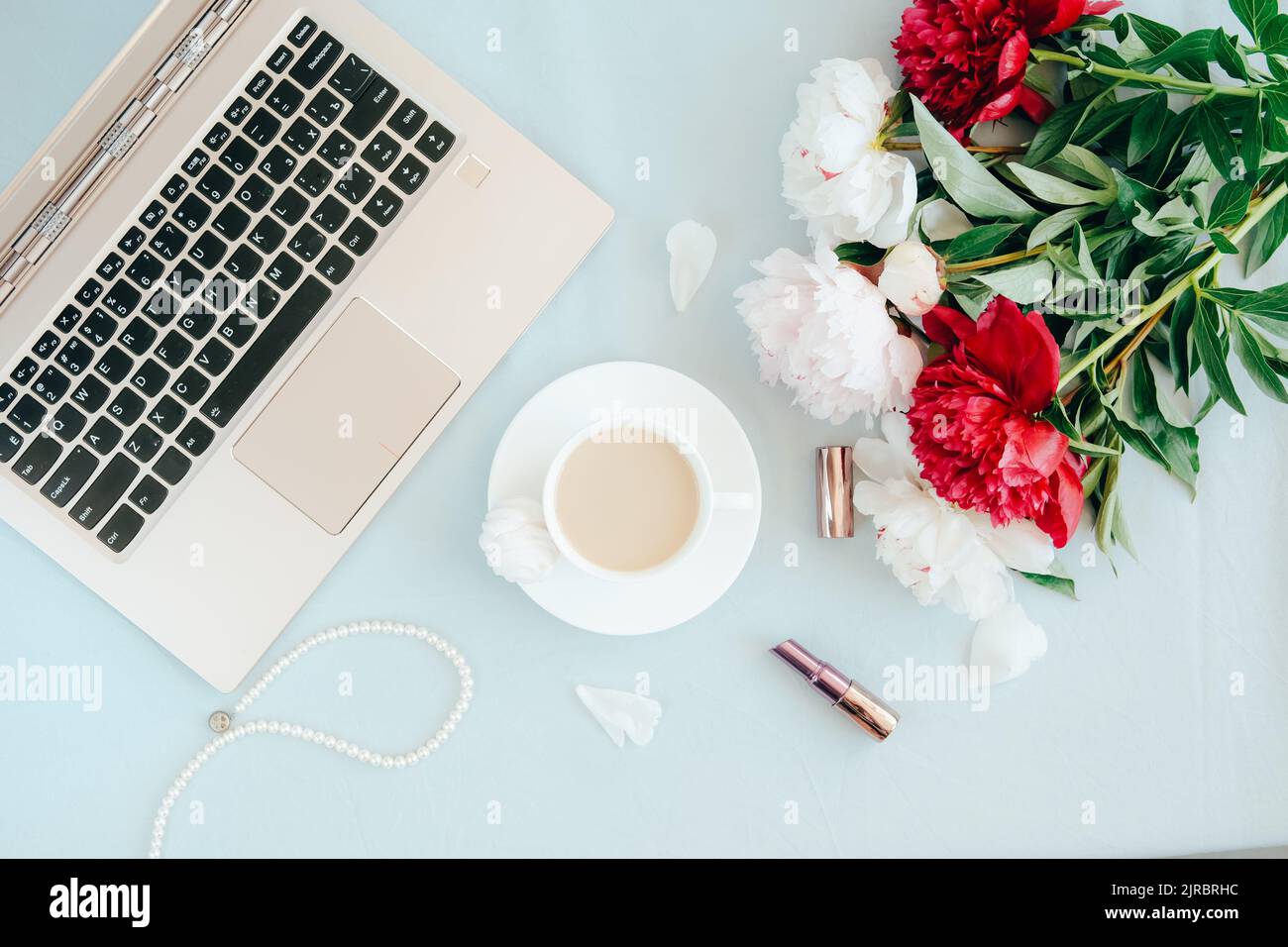Modern home office concept. Computer, coffee and flowers Stock Photo ...
