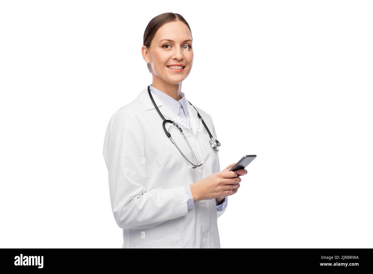 Smiling doctor texting mobile phone hi-res stock photography and images ...