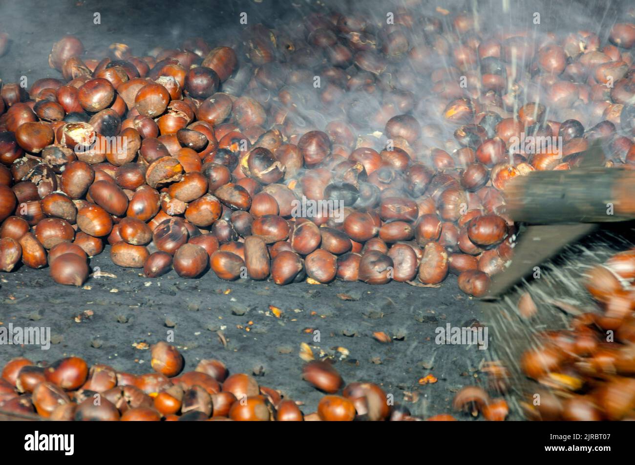 roasted chestnuts cooked on the grill in autumn Stock Photo - Alamy
