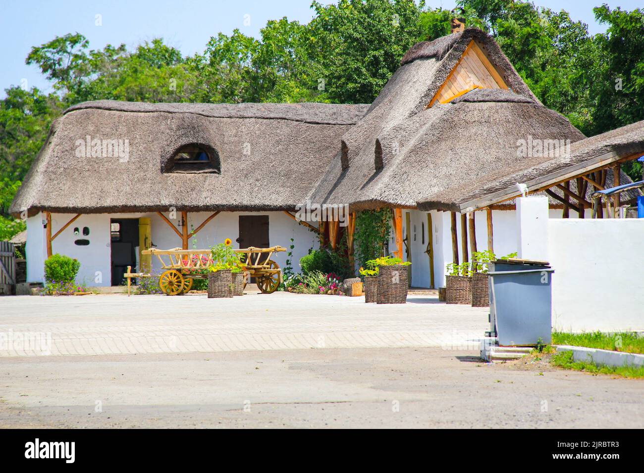 Ancient national traditional house of Ukrainians with a thatched roof ...