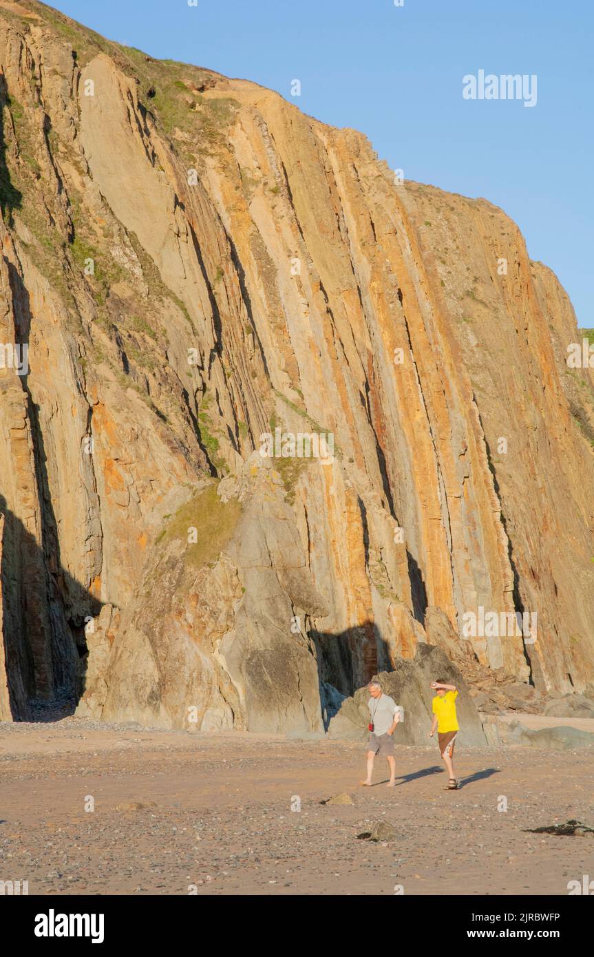 Vertical strata at the Three Chimneys rock formation on Marloes Sands ...