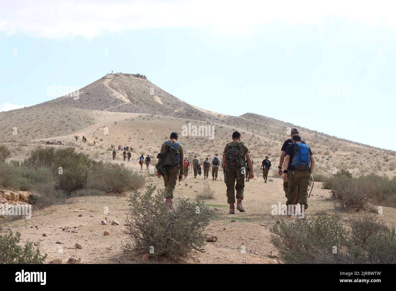 The syrian soldiers walking in the desert from behind Stock Photo - Alamy