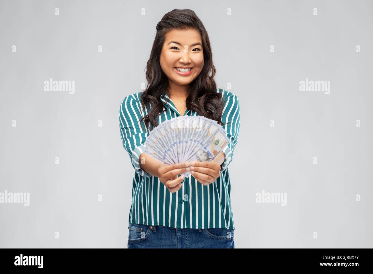 asian woman with hundred dollar money banknotes Stock Photo - Alamy