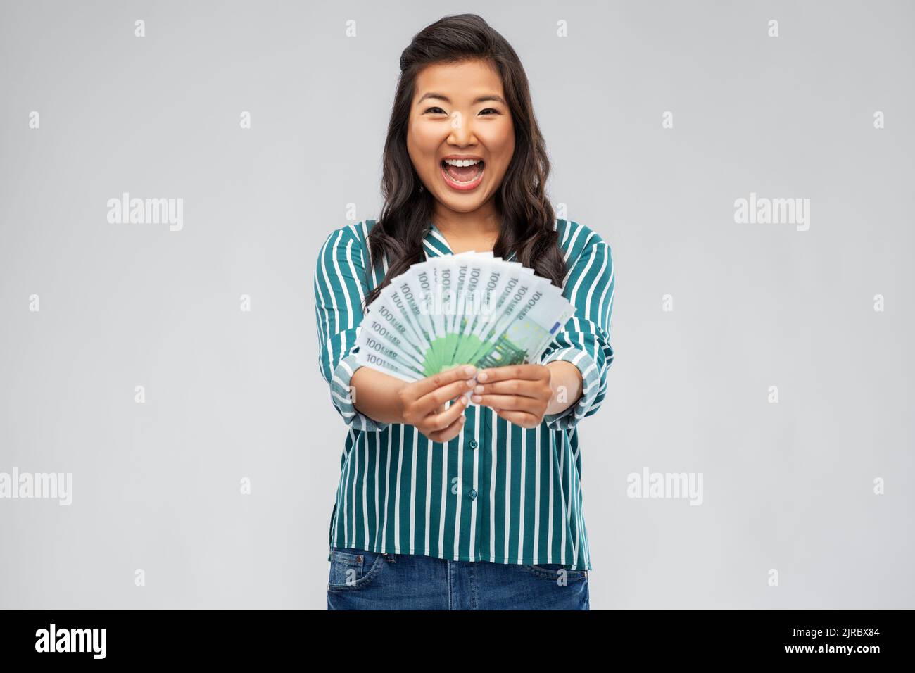 asian woman with hundred euro money banknotes Stock Photo - Alamy