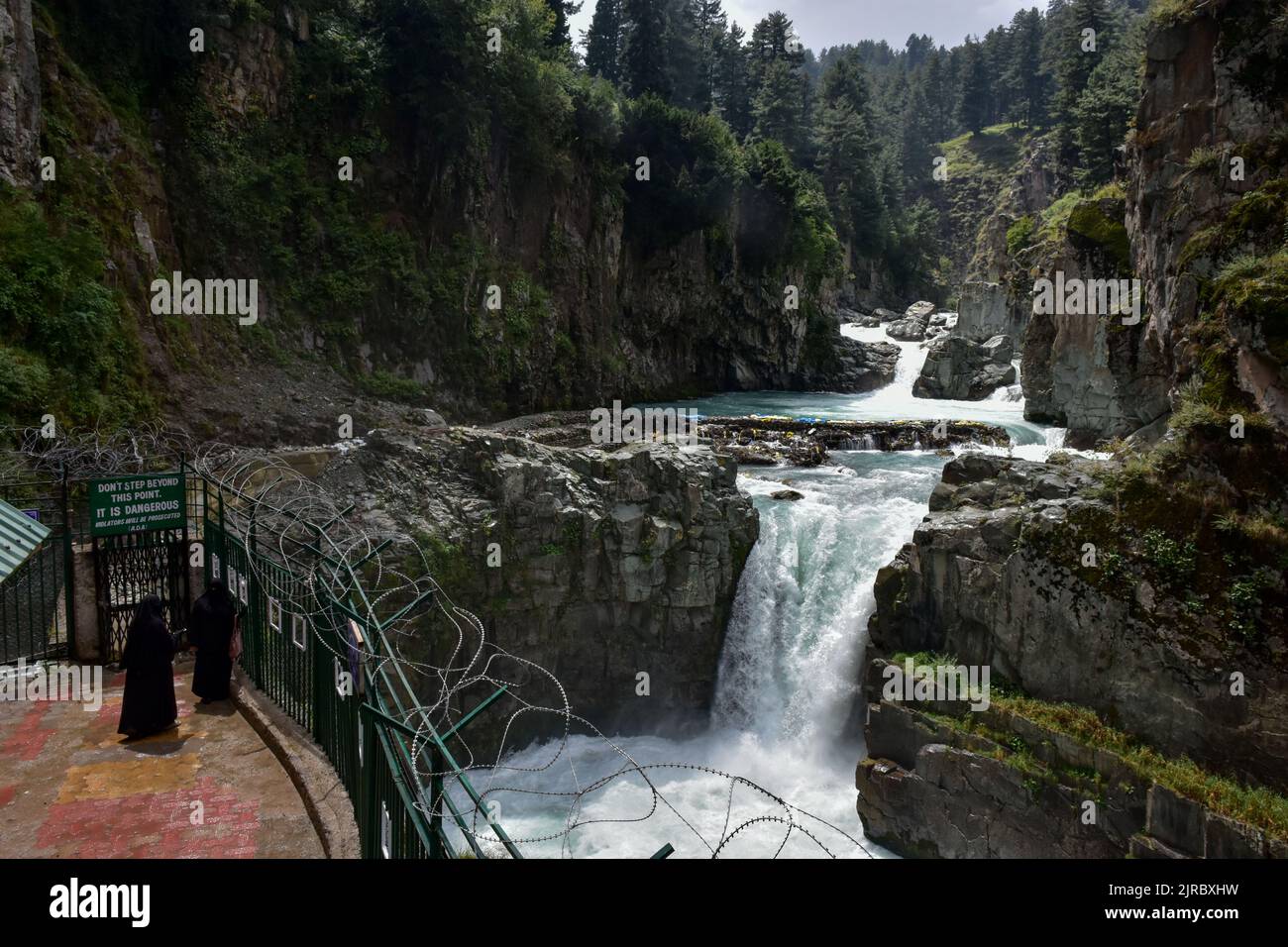 Visitors explore the Aharbal waterfall, also known as "Niagara ...