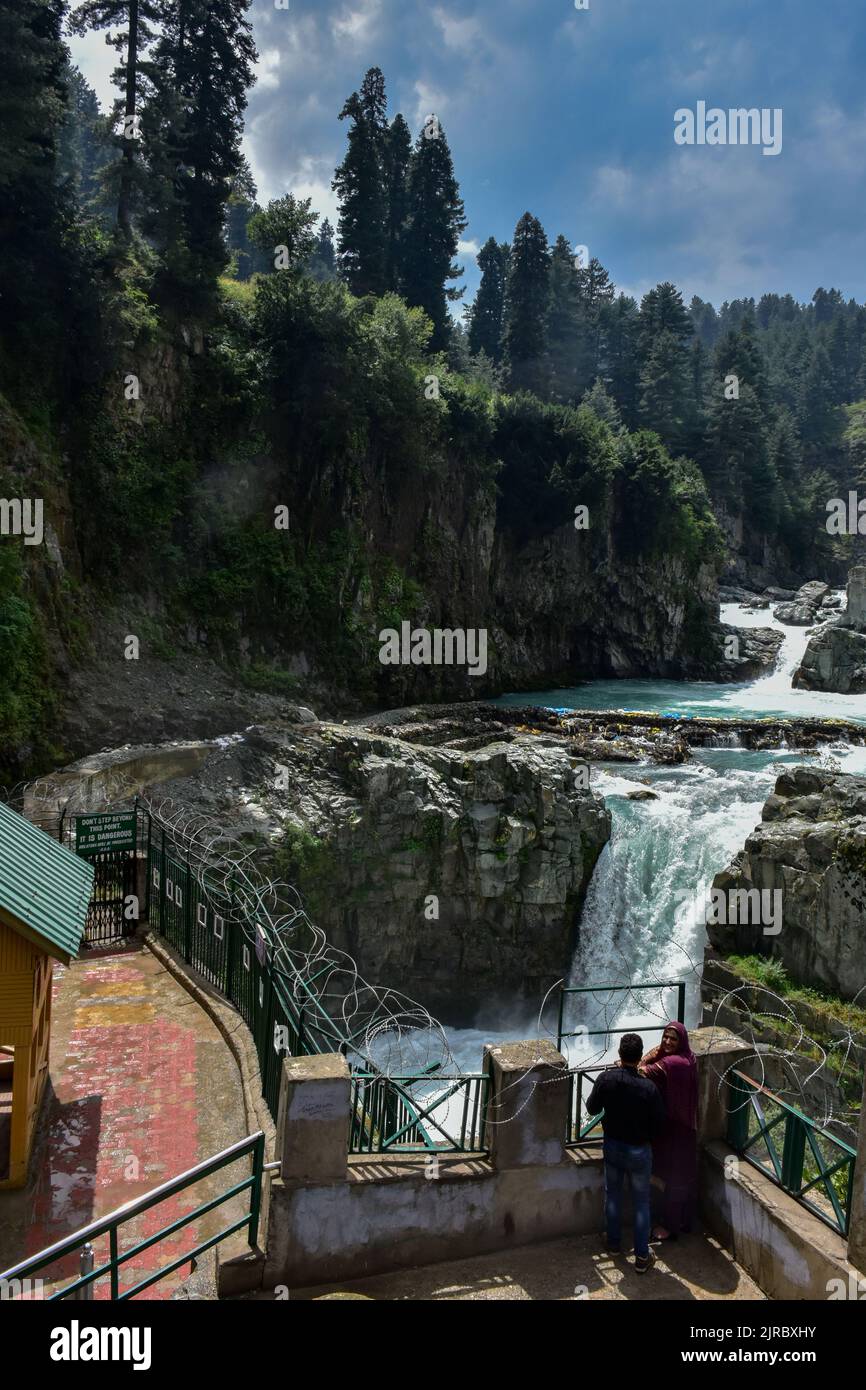 A couple explores the Aharbal waterfall, also known as "Niagara ...