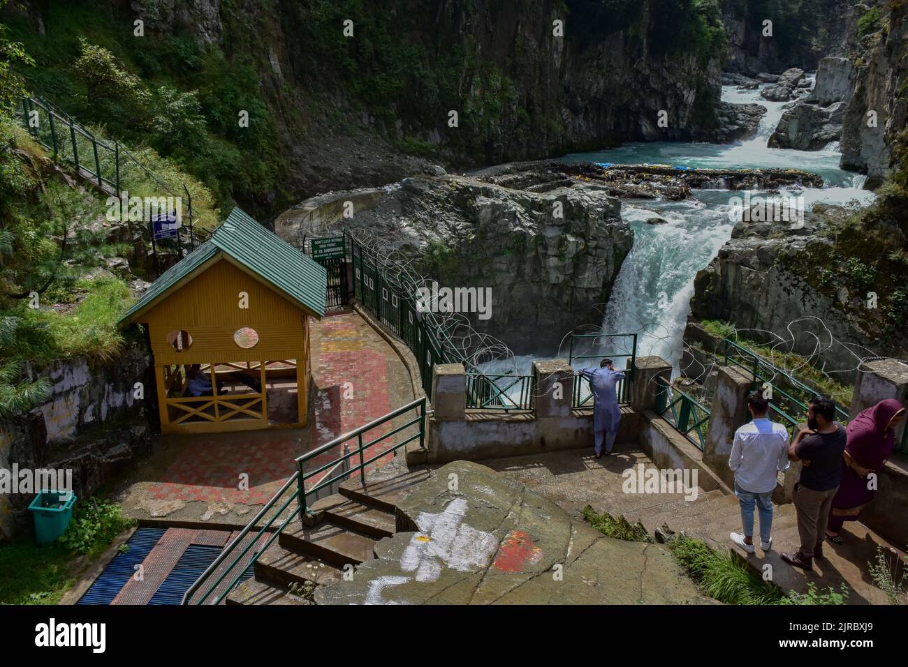 Visitors explore the Aharbal waterfall, also known as "Niagara ...