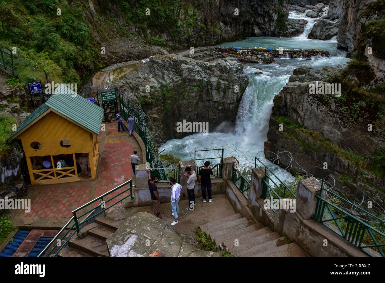 Visitors explore the Aharbal waterfall, also known as "Niagara ...