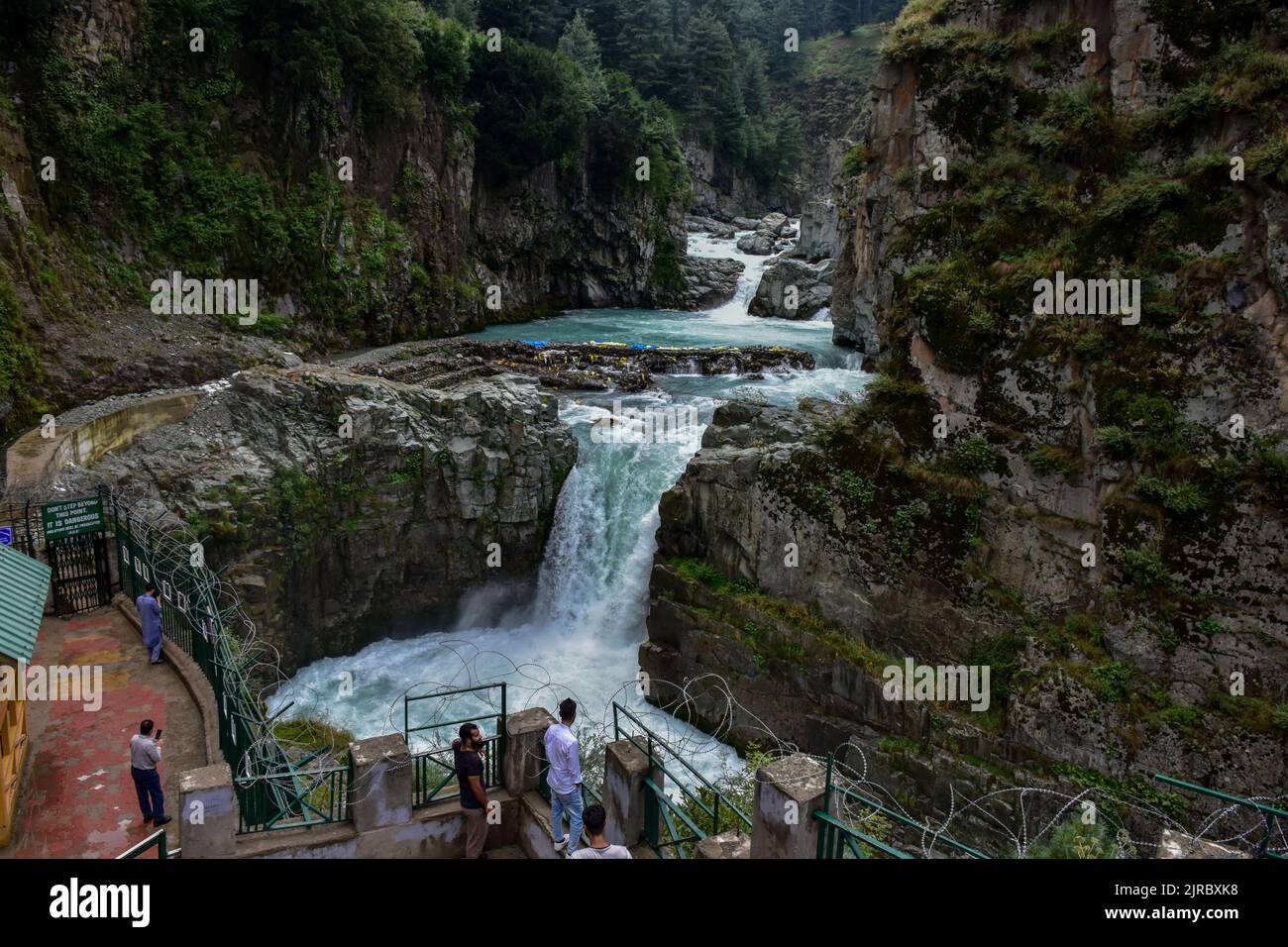 Visitors explore the Aharbal waterfall, also known as "Niagara ...