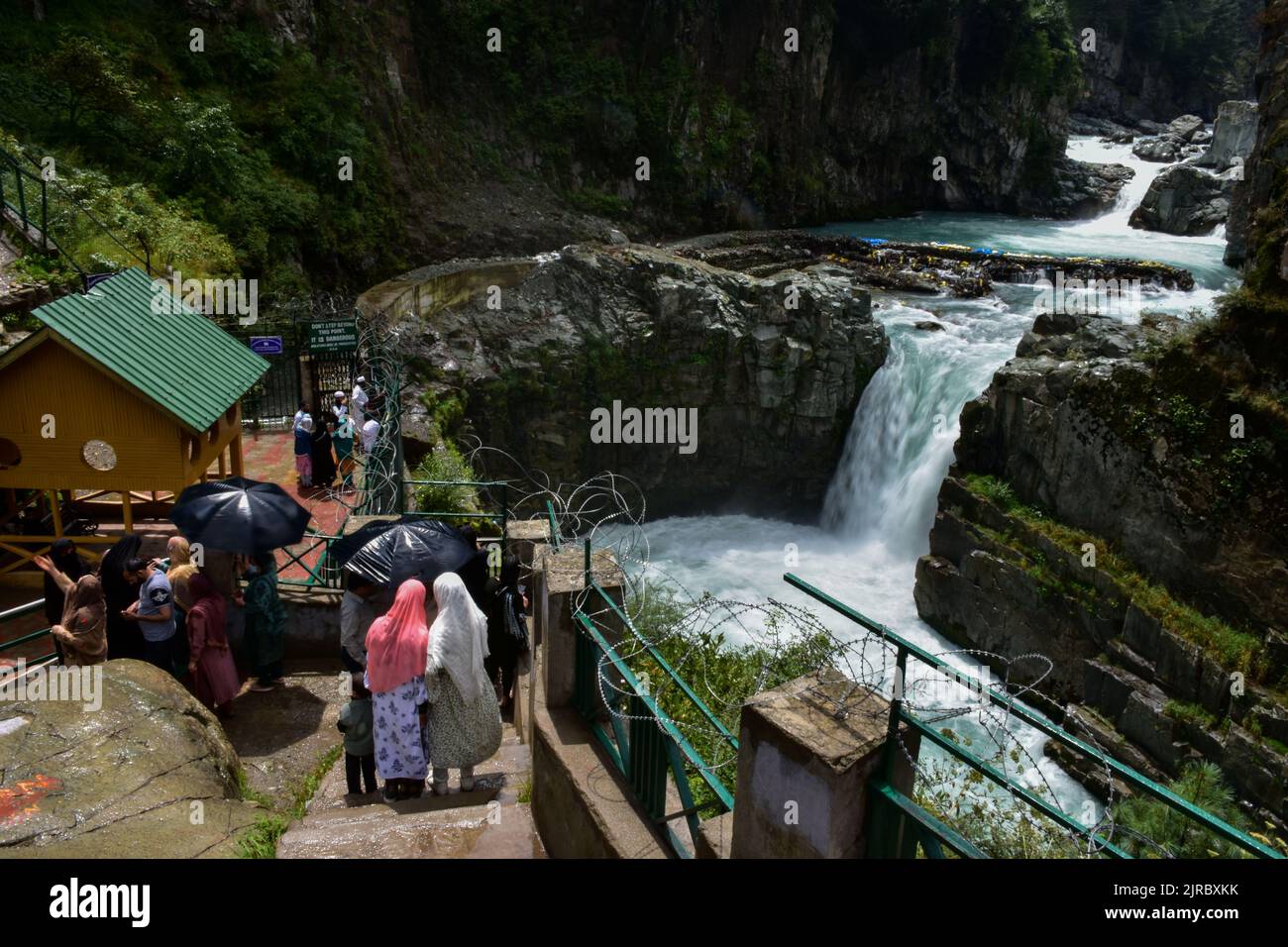 Visitors explore the Aharbal waterfall, also known as "Niagara ...