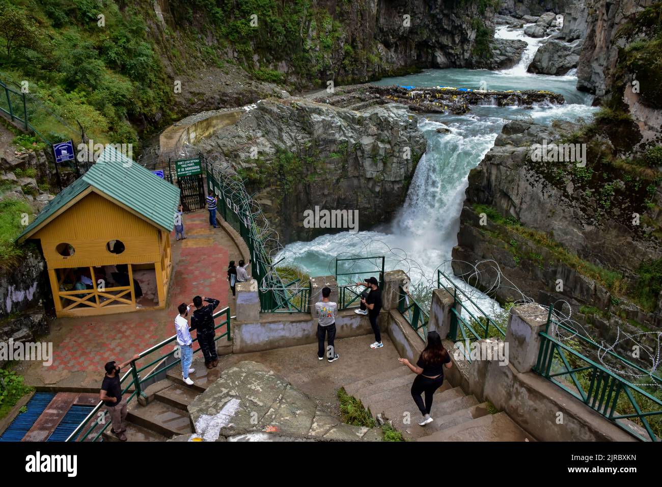 Visitors explore the Aharbal waterfall, also known as "Niagara ...