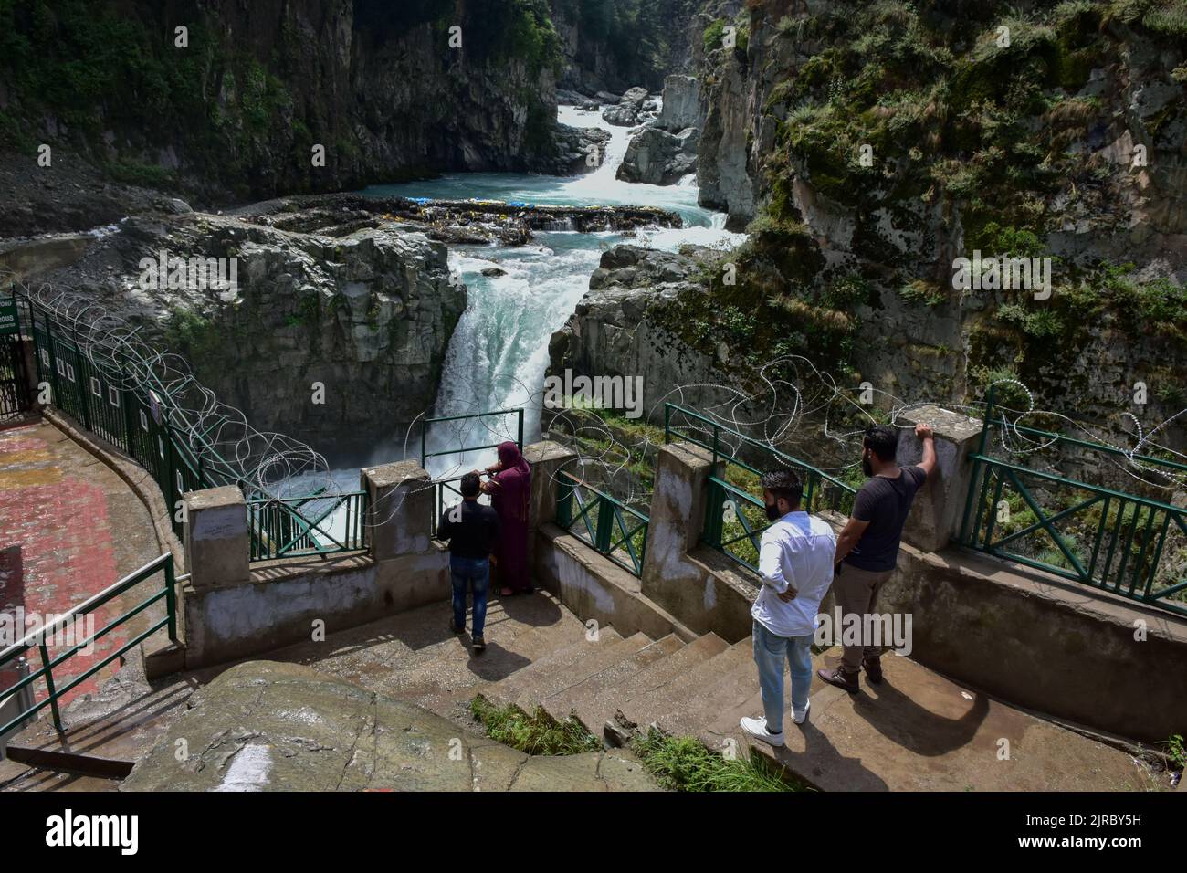 Visitors explore the Aharbal waterfall, also known as "Niagara ...