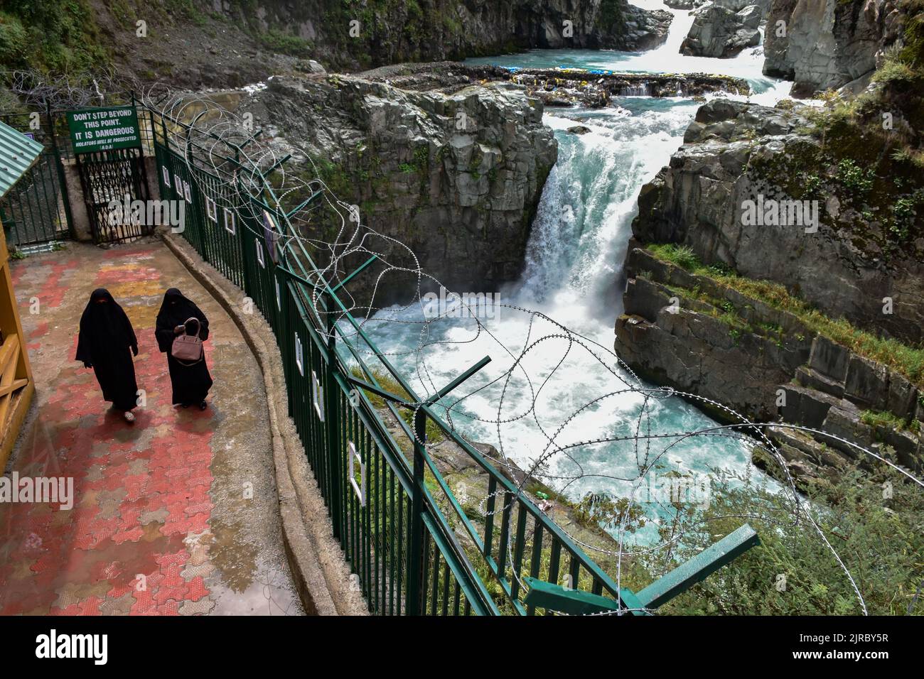 Visitors explore the Aharbal waterfall, also known as "Niagara ...