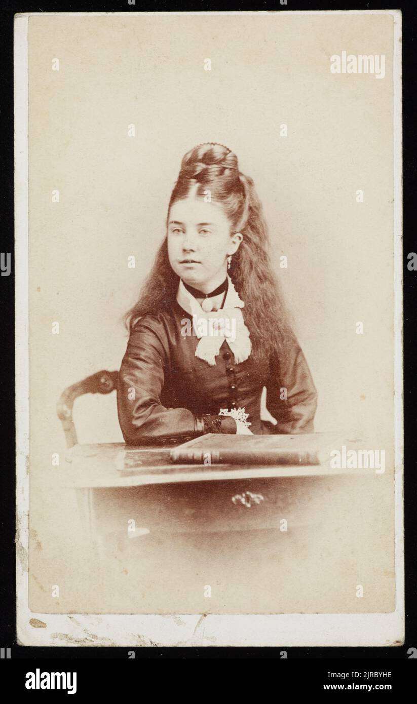 Young woman seated behind a desk, circa 1876, Christchurch, by M ...