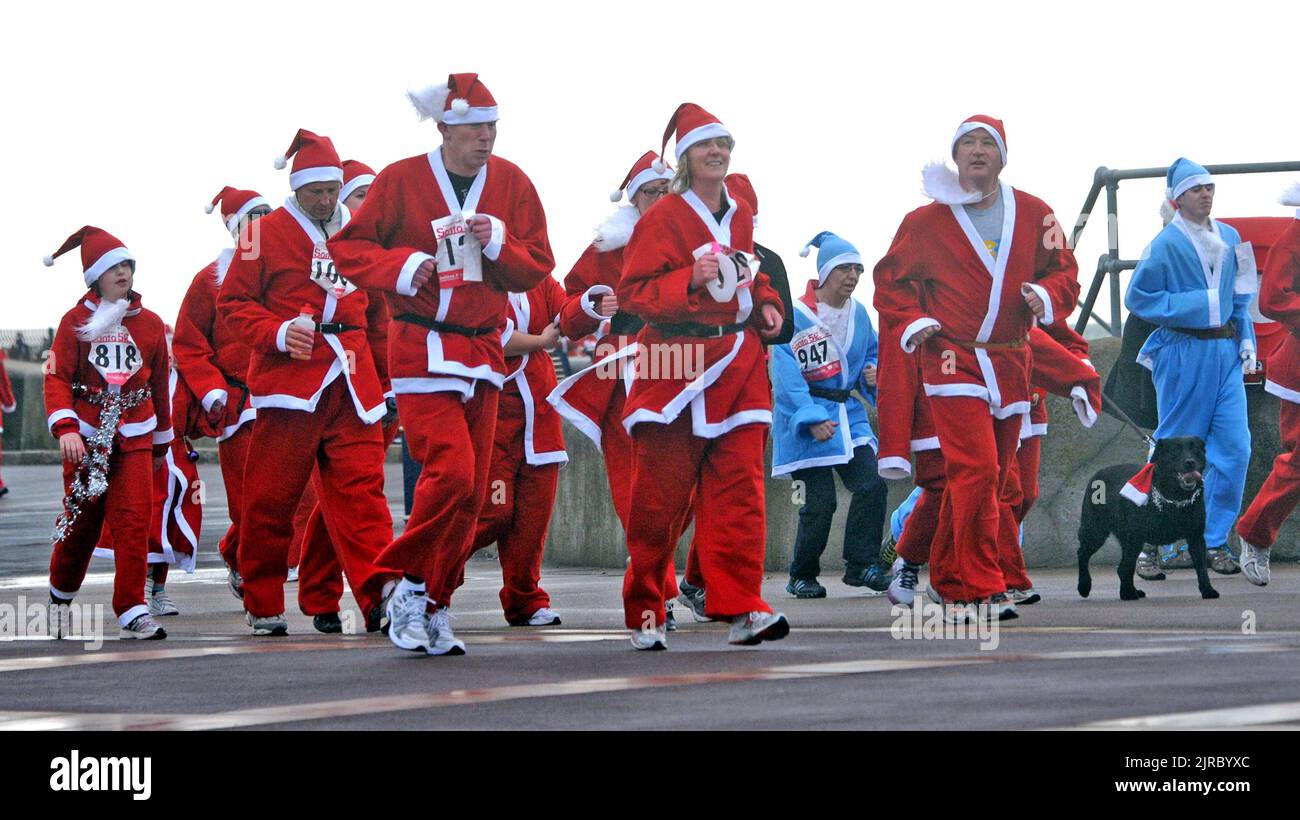 WAVES AND SPRAY BATTER HUNDREDS OF RUNNERS WHO BRAVED THE ELEMENTS IN THE ANNUAL RNLI SANTA 10K ...