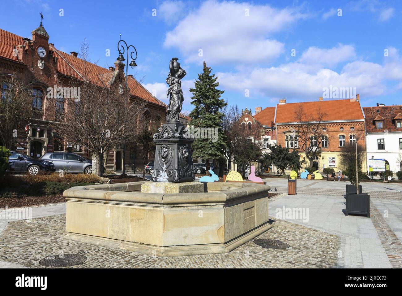 The fountain on the main market square in Myslenice, Poland Stock Photo ...