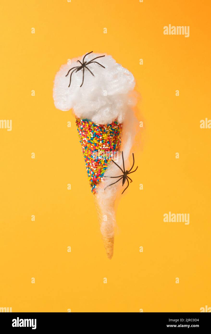 Minimal creative concept made of ice cream cone with sprinkles, spider ...