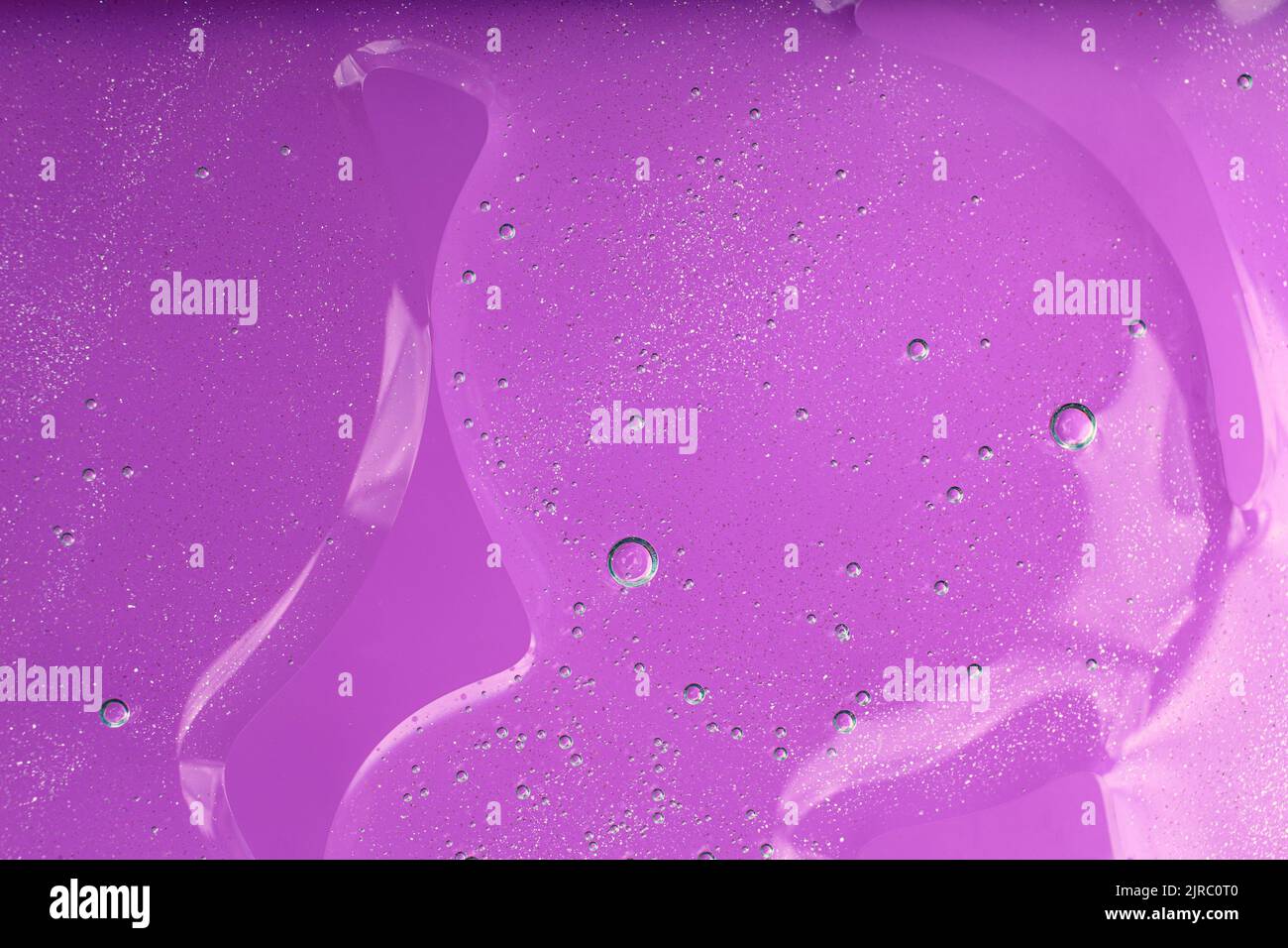 Macro photography of bubbly smear on purple background Stock Photo - Alamy