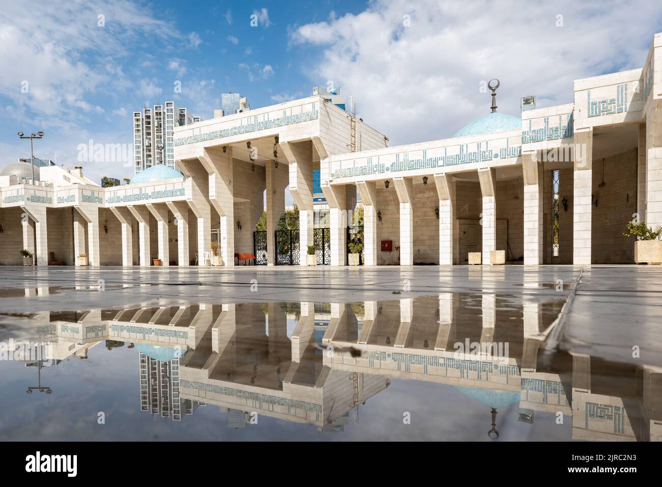 The King Abdullah I Mosque in Amman, Jordan, with reflections in puddle ...