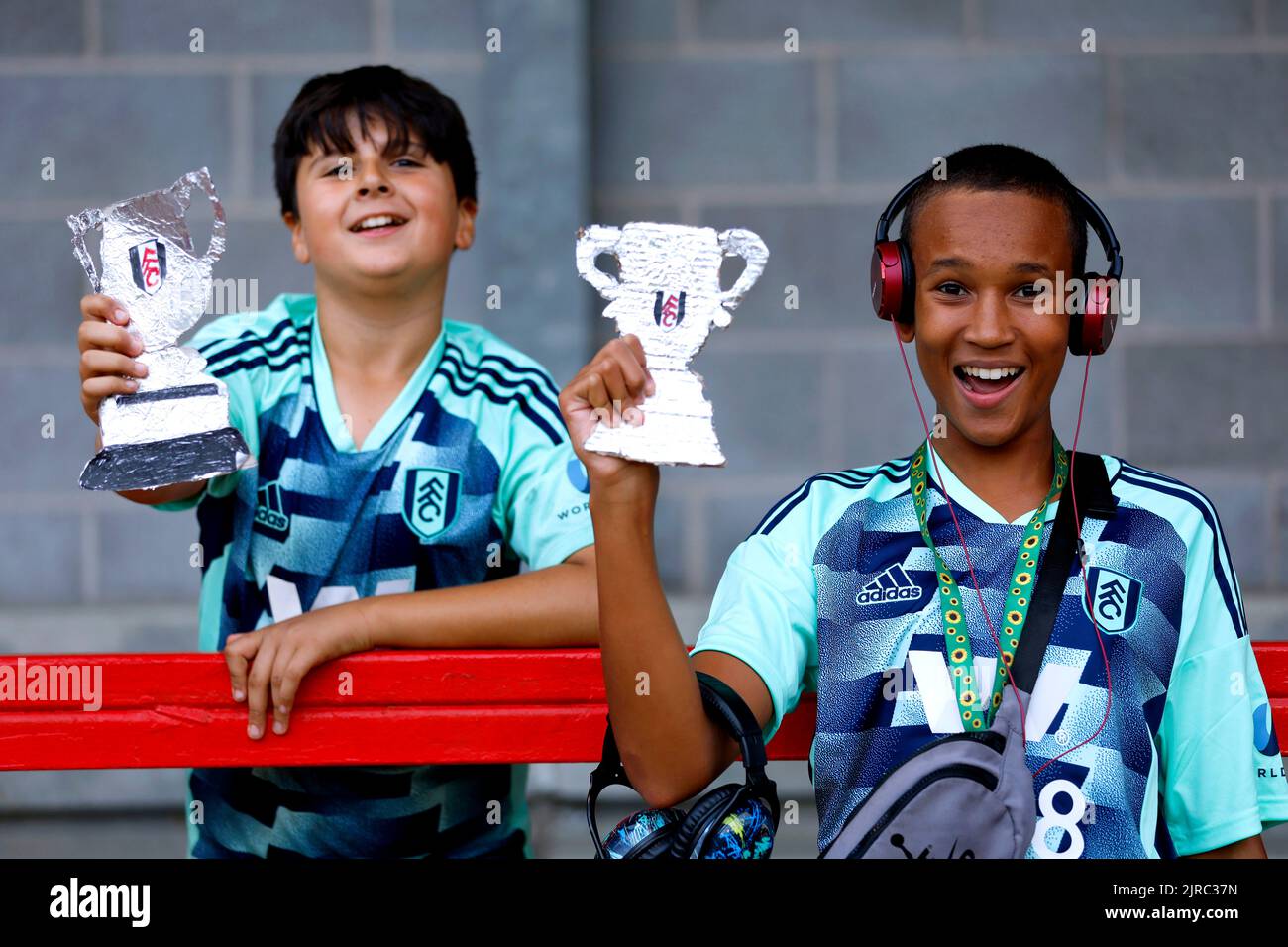 Fulham fans hold up replicas of the Carabao Cup trophy ahead of the ...