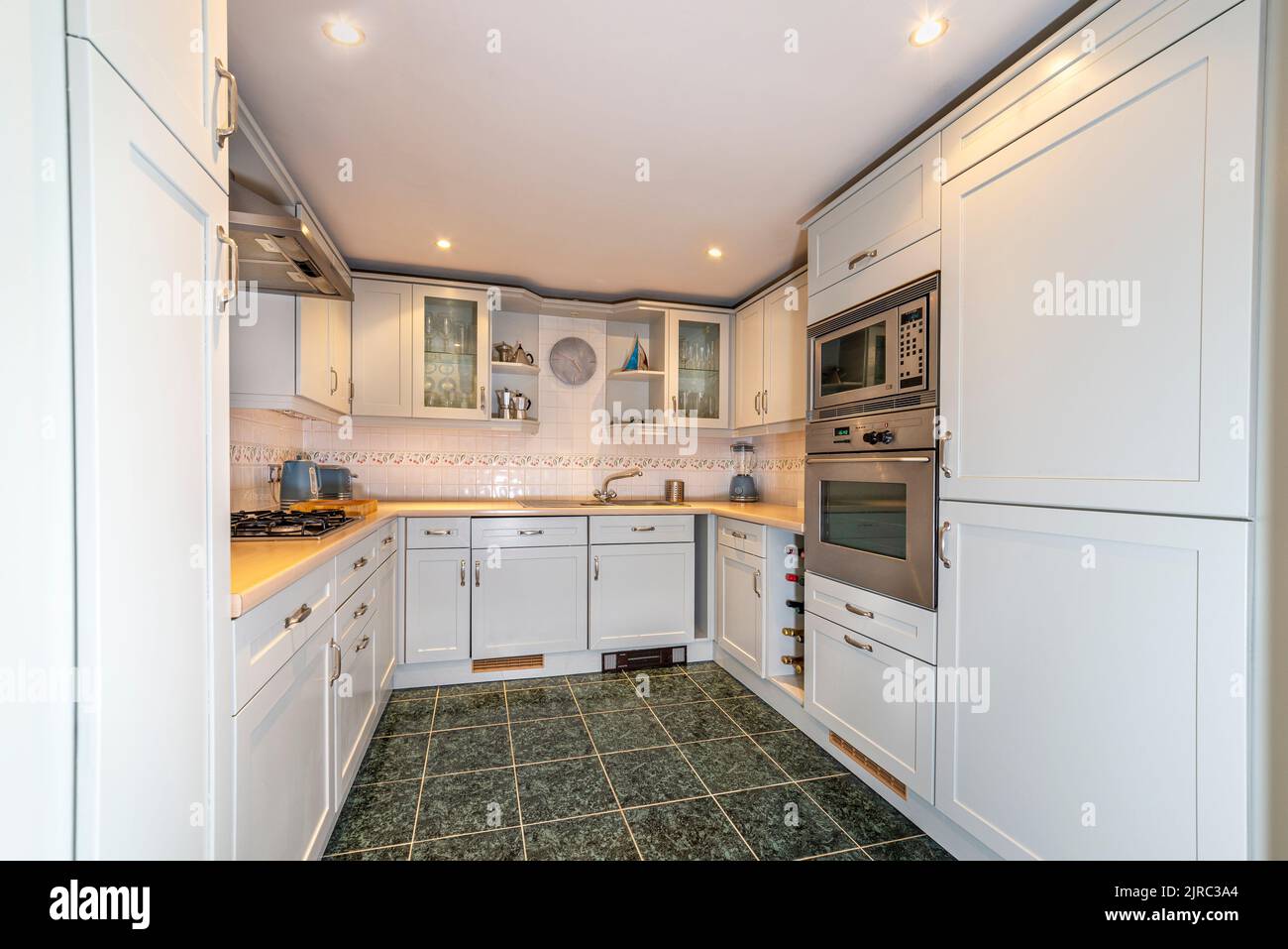 Painted kitchen in a modern apartment Stock Photo - Alamy