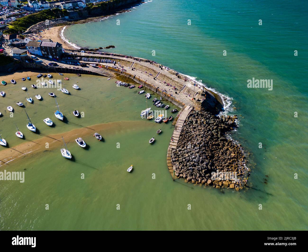 Aerial view of boats in the harbour at low tide in the Welsh seaside ...