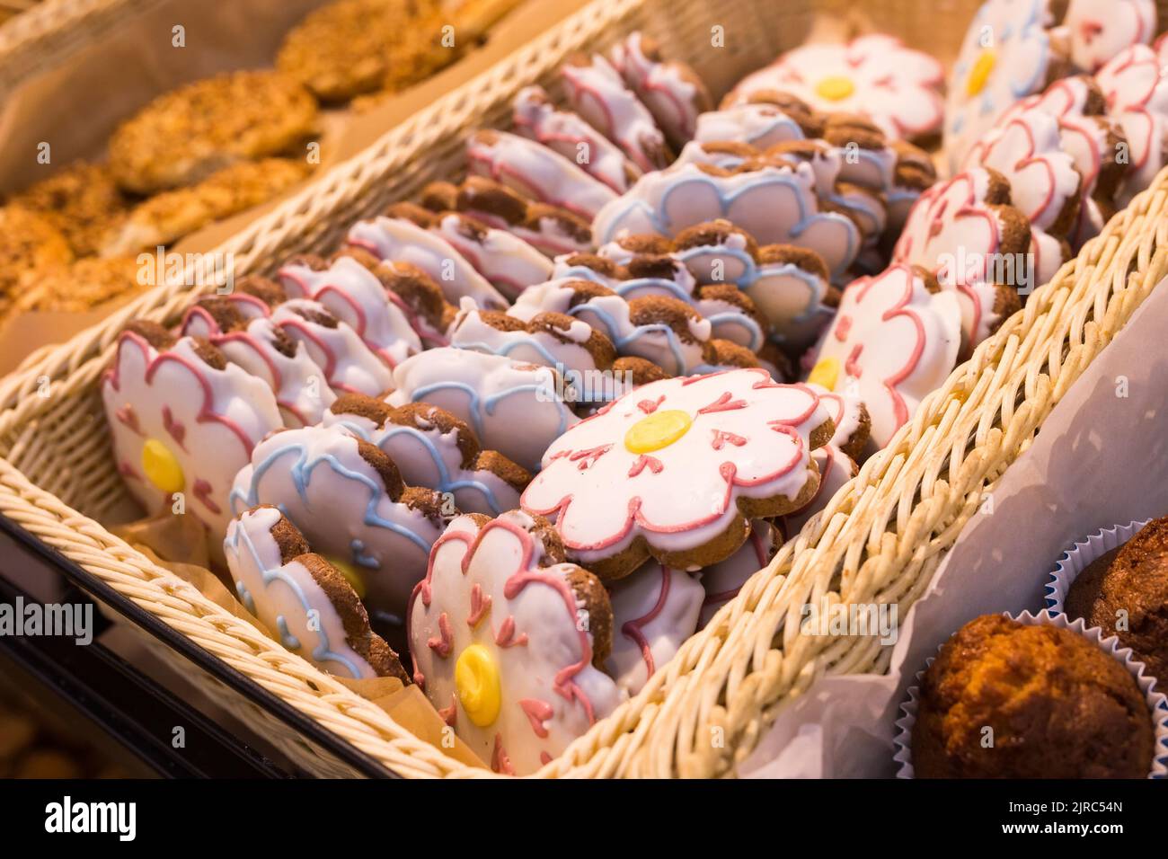 glazed flower shaped pastries on a bakery counter Stock Photo - Alamy