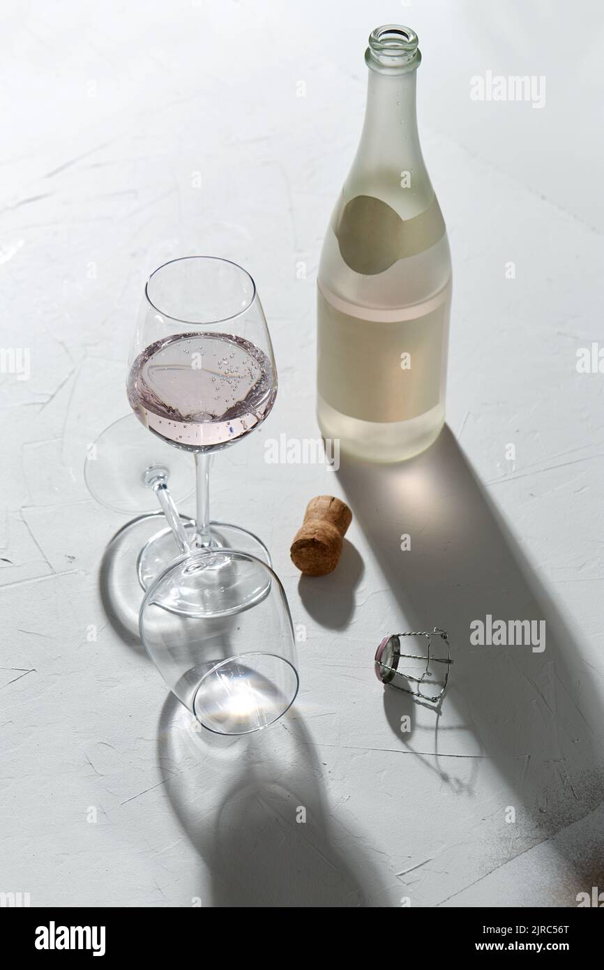 wine glasses and champagne bottle dropping shadows Stock Photo - Alamy