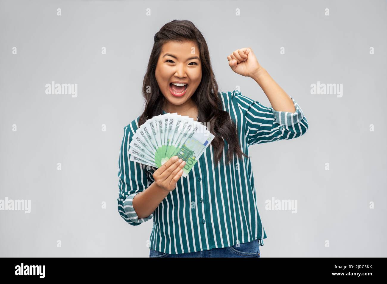 happy asian woman with money celebrating success Stock Photo - Alamy