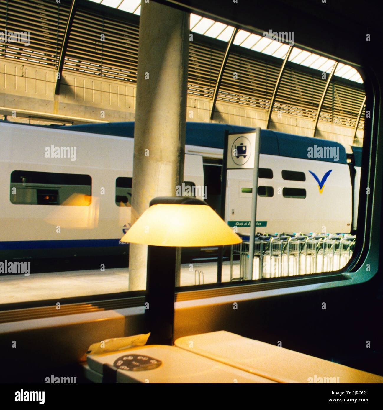 AVE train car empty first class seat by the window when train is still ...