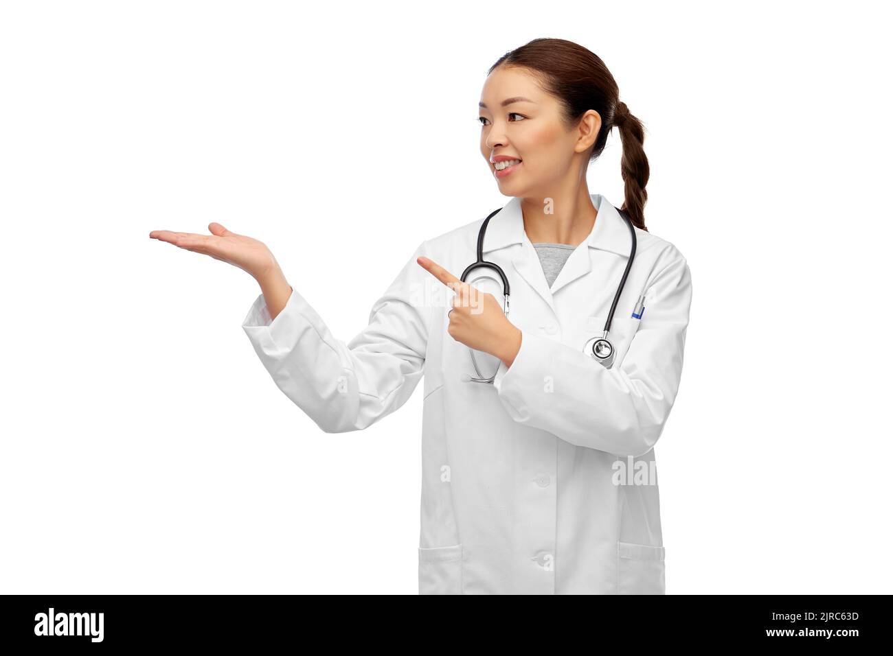 asian female doctor holding something on hand Stock Photo - Alamy